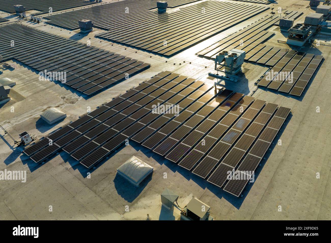 Photovoltaic solar panels mounted on industrial building roof for ...