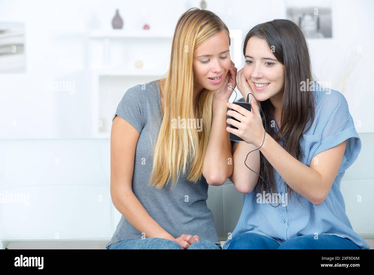two women are sharing secrets Stock Photo - Alamy