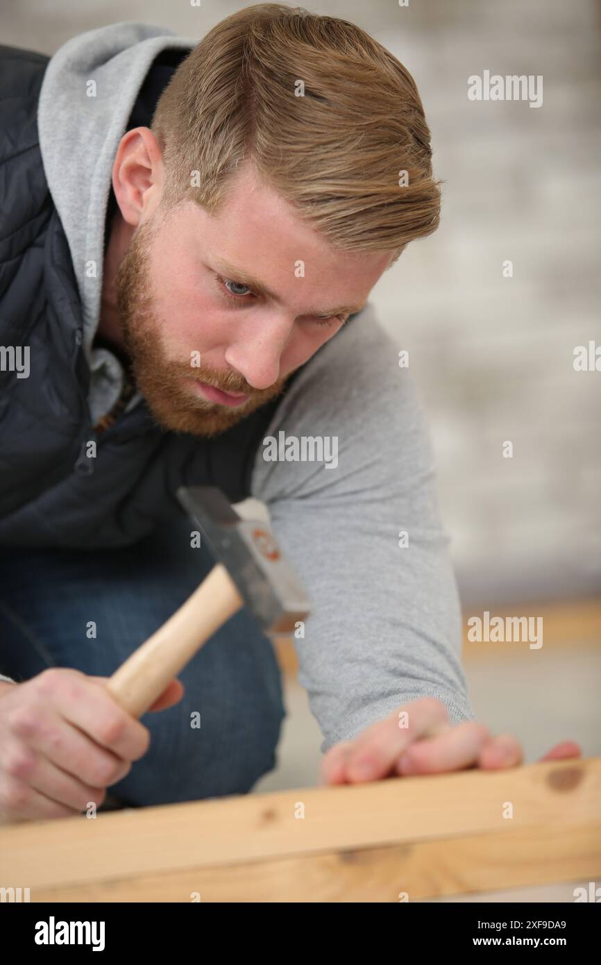 hammering man hammer nail Stock Photo - Alamy