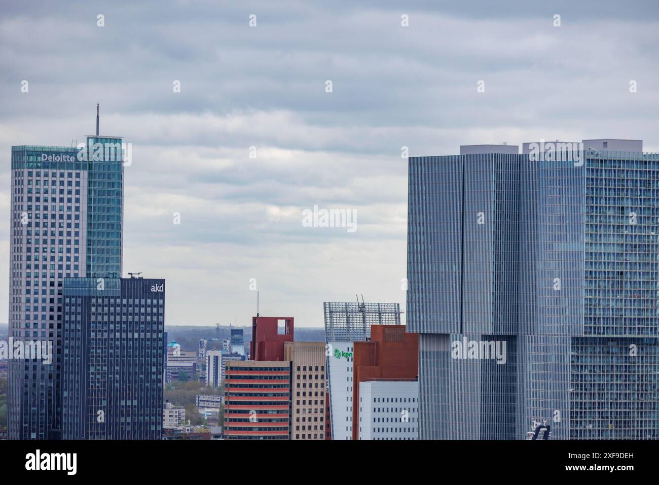 City view with several modern skyscrapers under a cloudy sky, Rotterdam ...