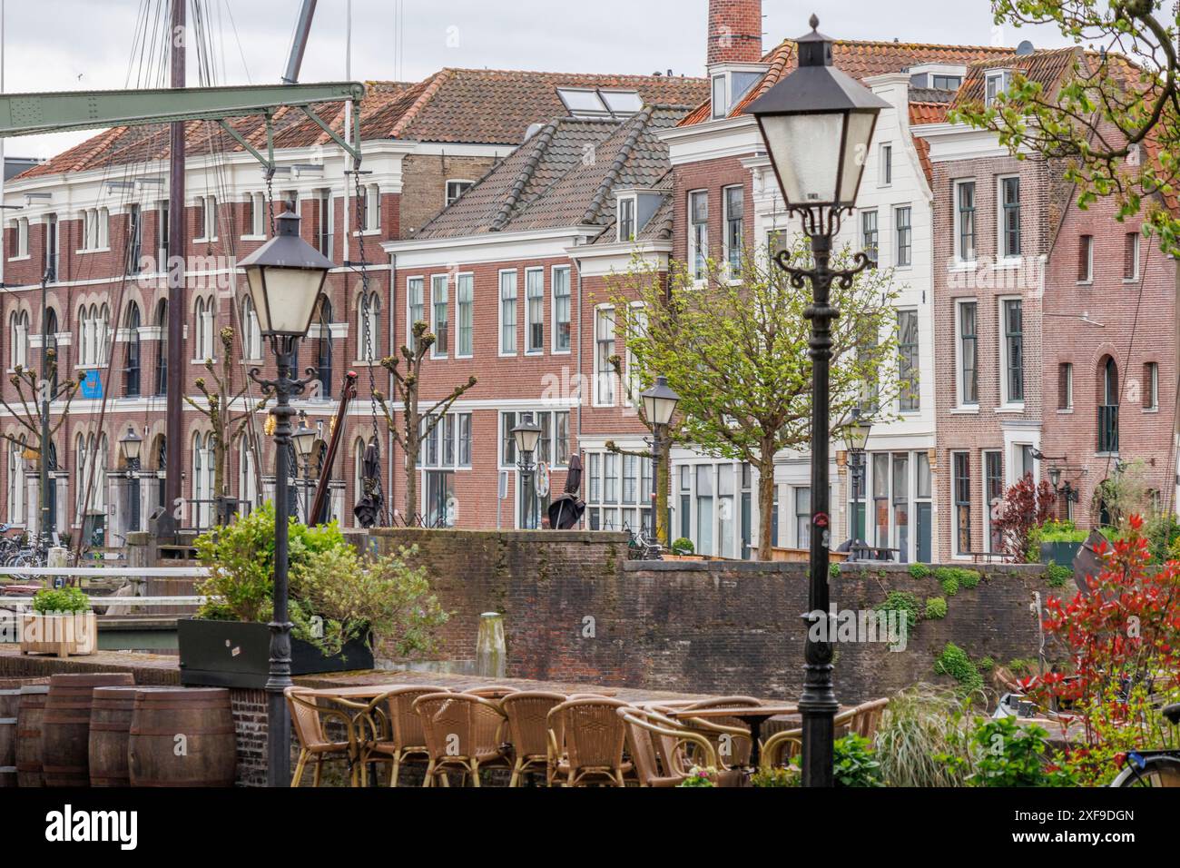 Canal view with chairs, tables and historic buildings, Rotterdam ...