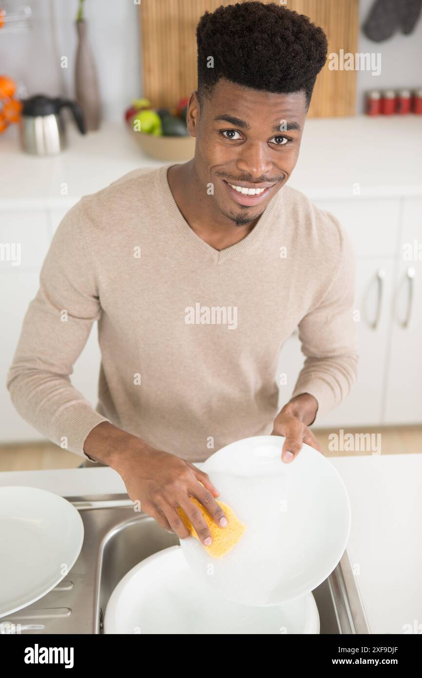 African american man washing dishes hi-res stock photography and images ...