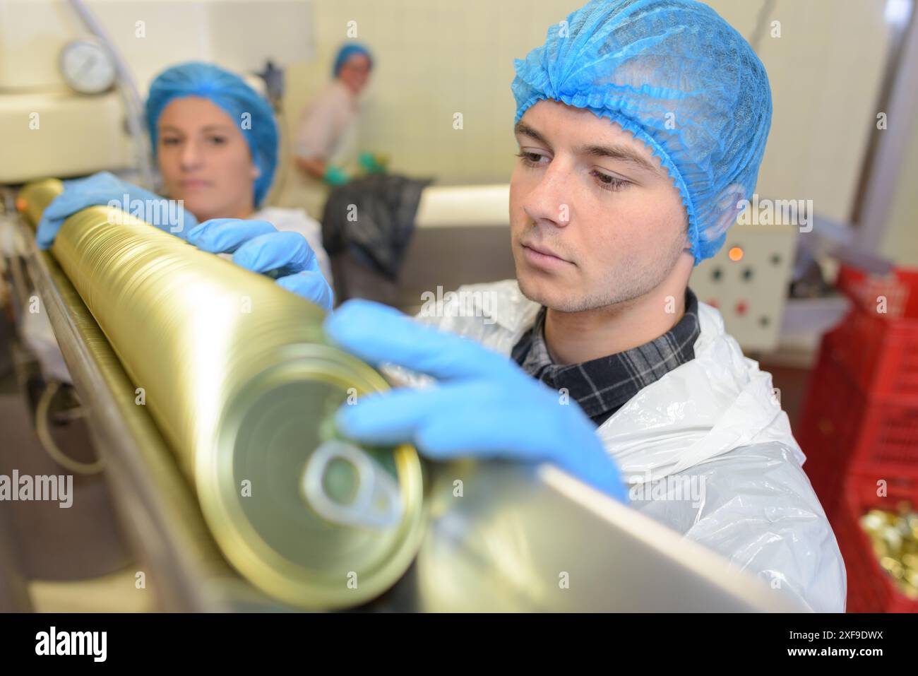 Factory worker using sealing machine hi-res stock photography and ...
