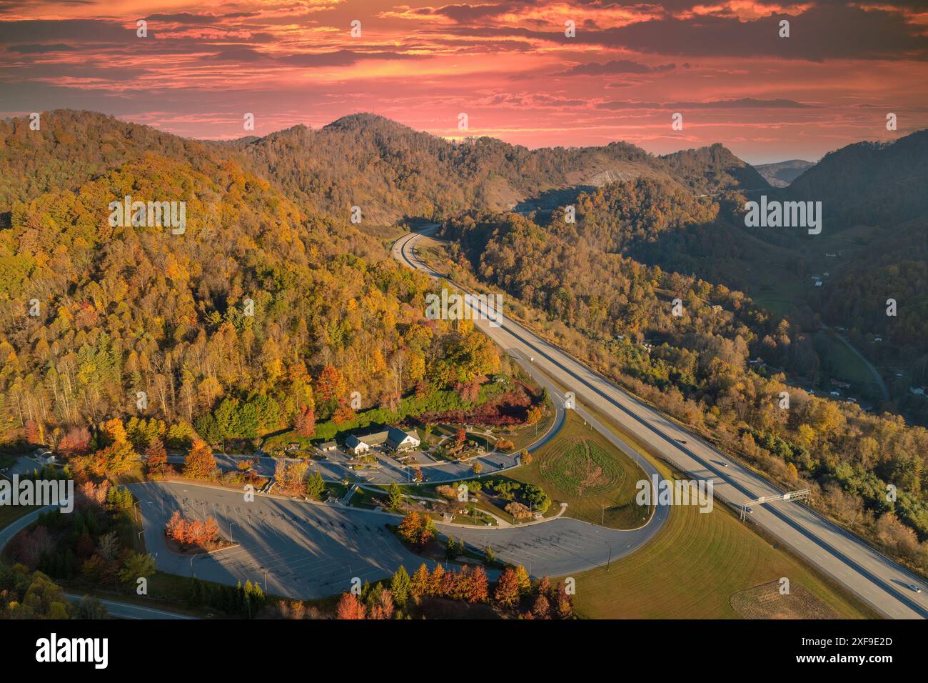 Rest area between golden fall forest near busy multilane American ...