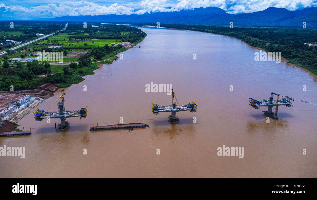 Aerial view of the construction site of the bridge over the Mekong ...