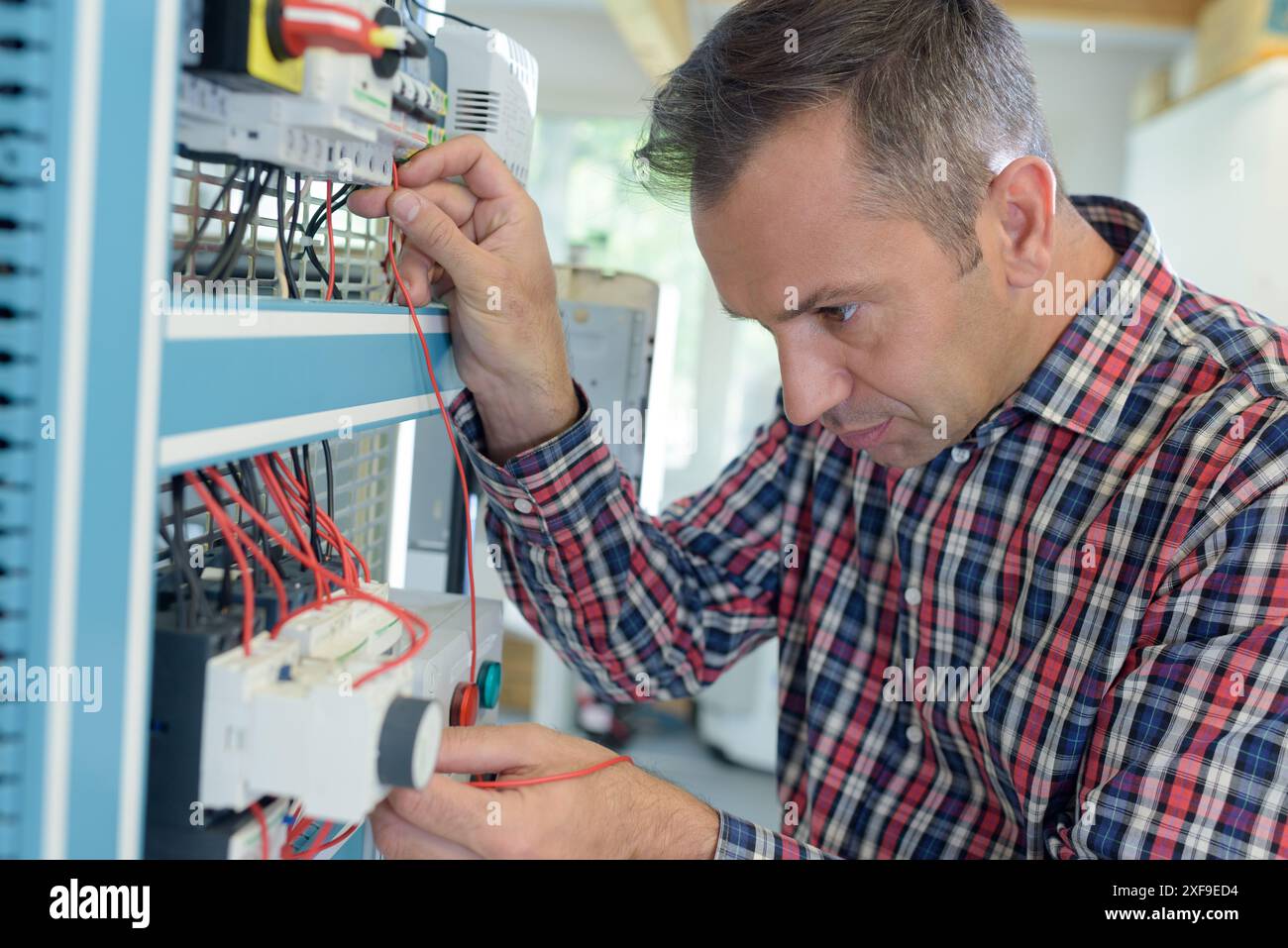 Engineer connecting network cable switch hi-res stock photography and ...
