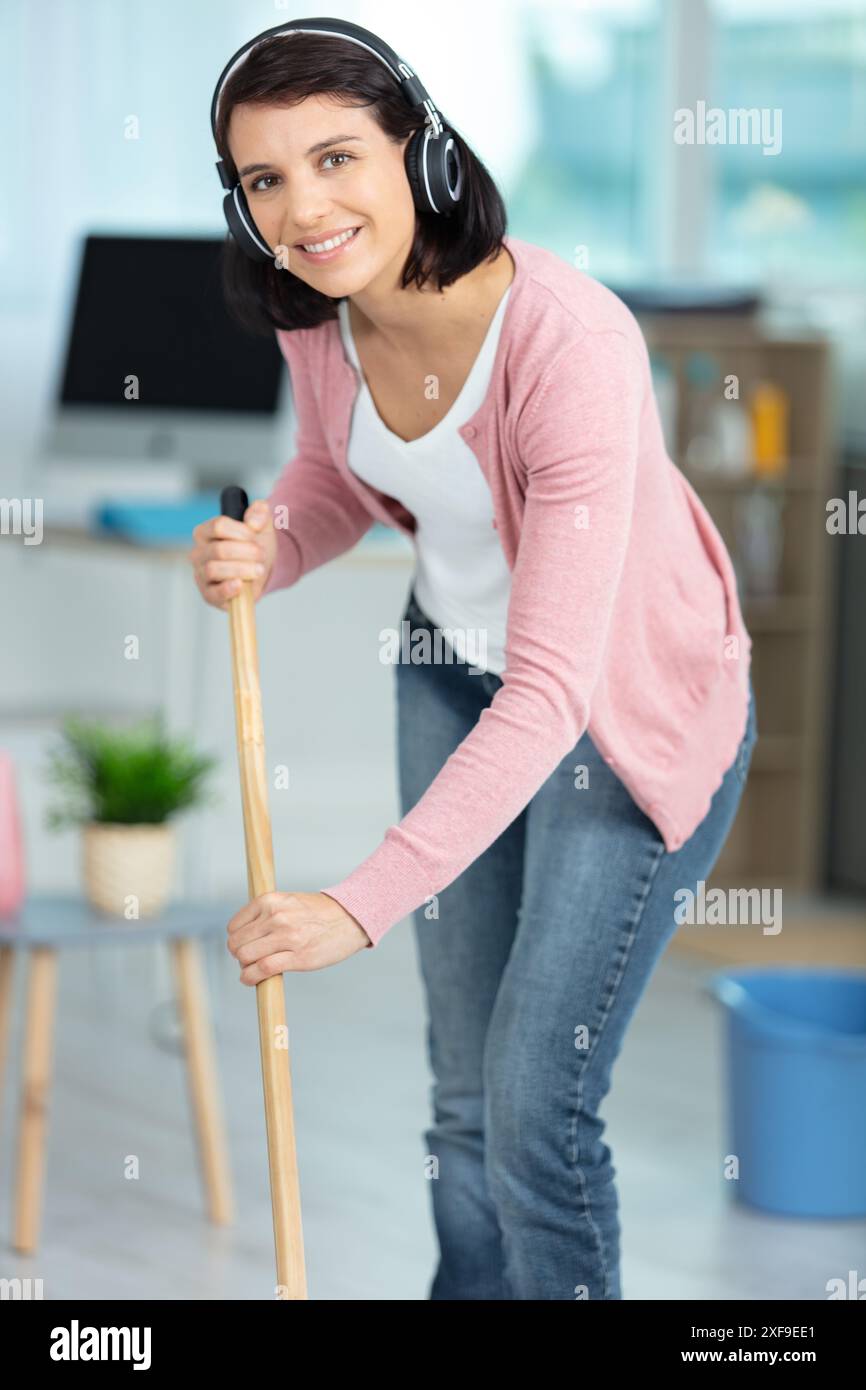Woman mopping floor wearing hi-res stock photography and images - Alamy