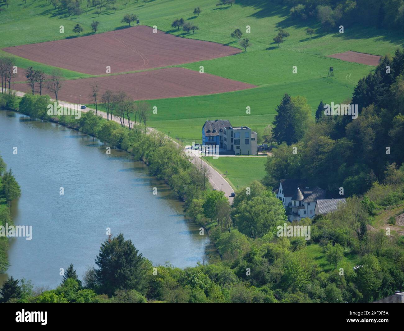 Rural landscape with river, fields, road and buildings, saarburg ...