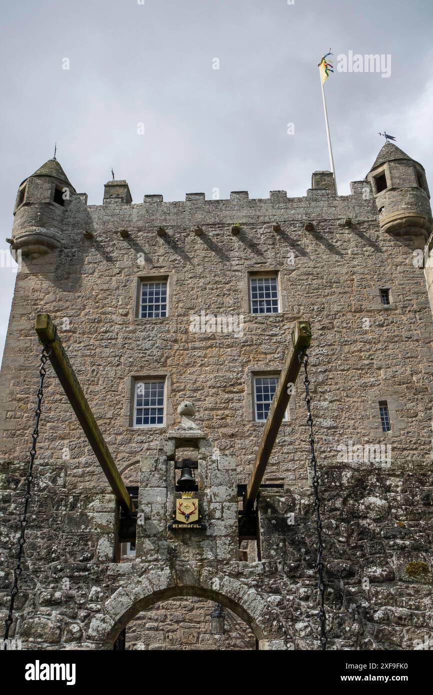 Close-up of a gatehouse with drawbridge and towers, against the sky ...