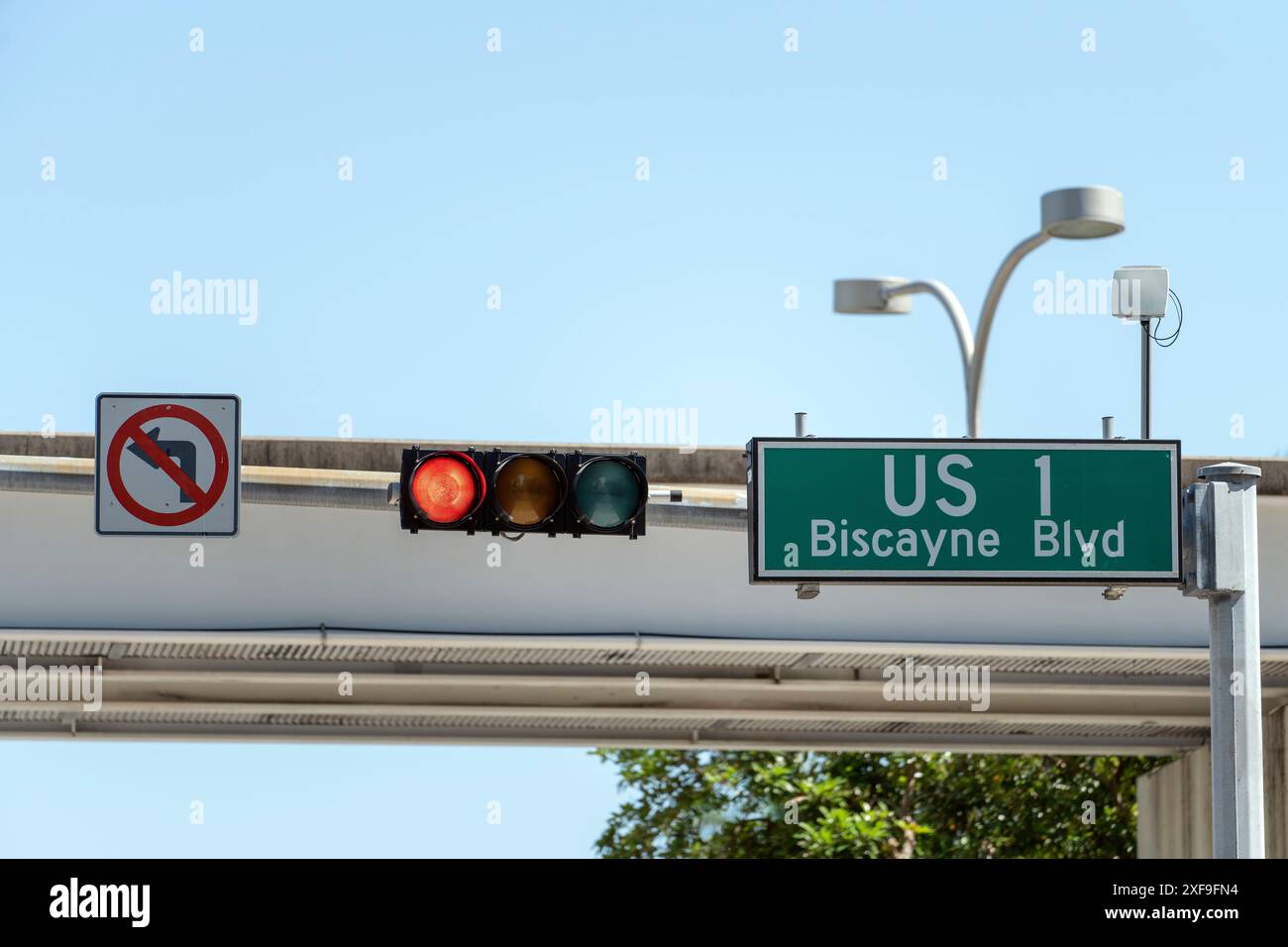 Traffic lights regulating driving cars on city street in Miami, Florida ...