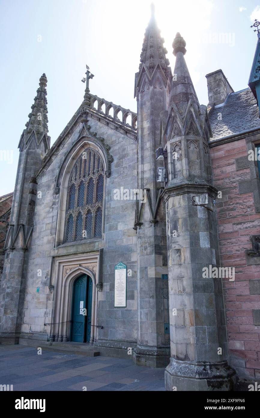 Gothic church with high stone pillars and ornate windows, illuminated ...
