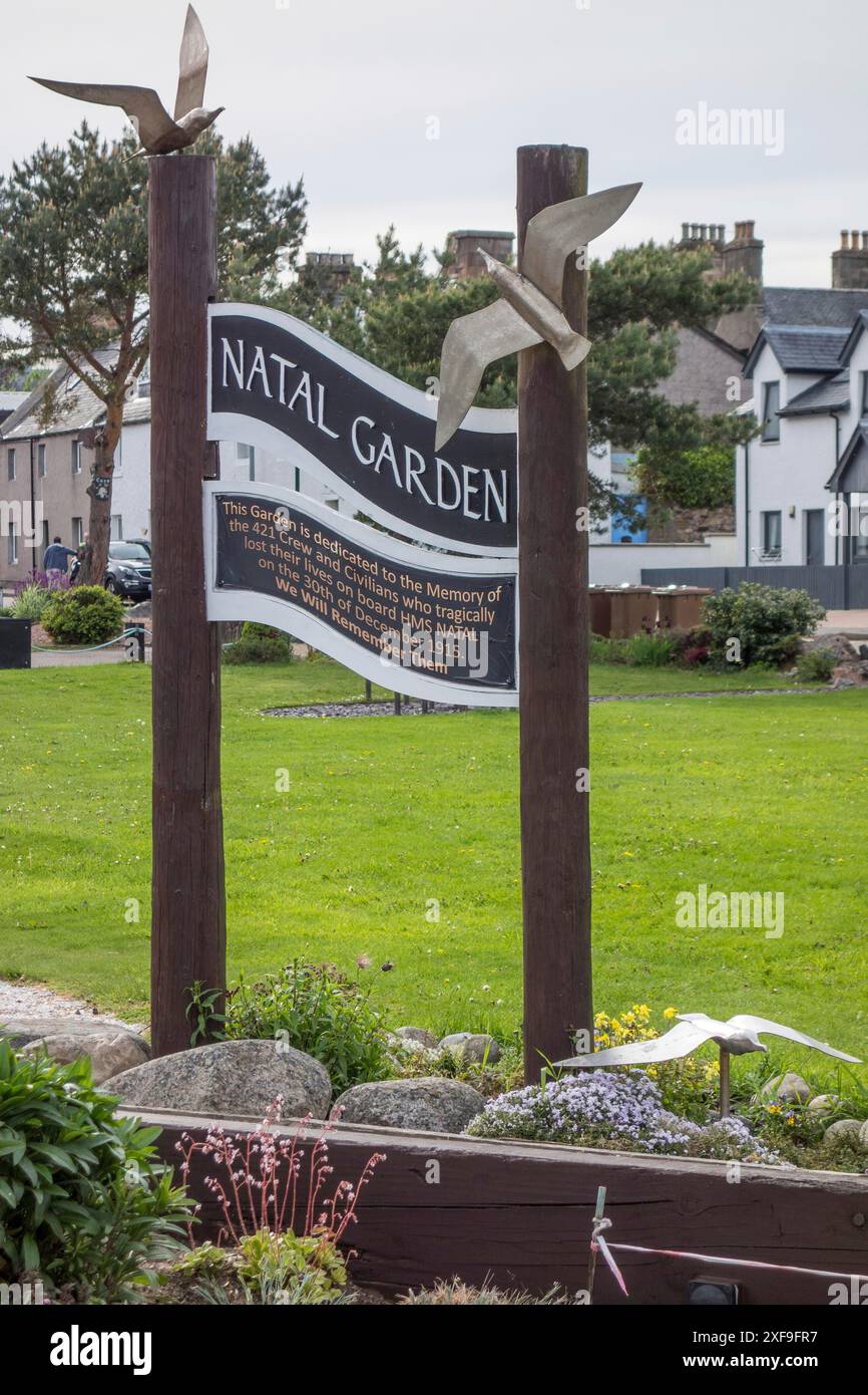 Garden with memorial plaque and bird sculptures, surrounded by lawns ...