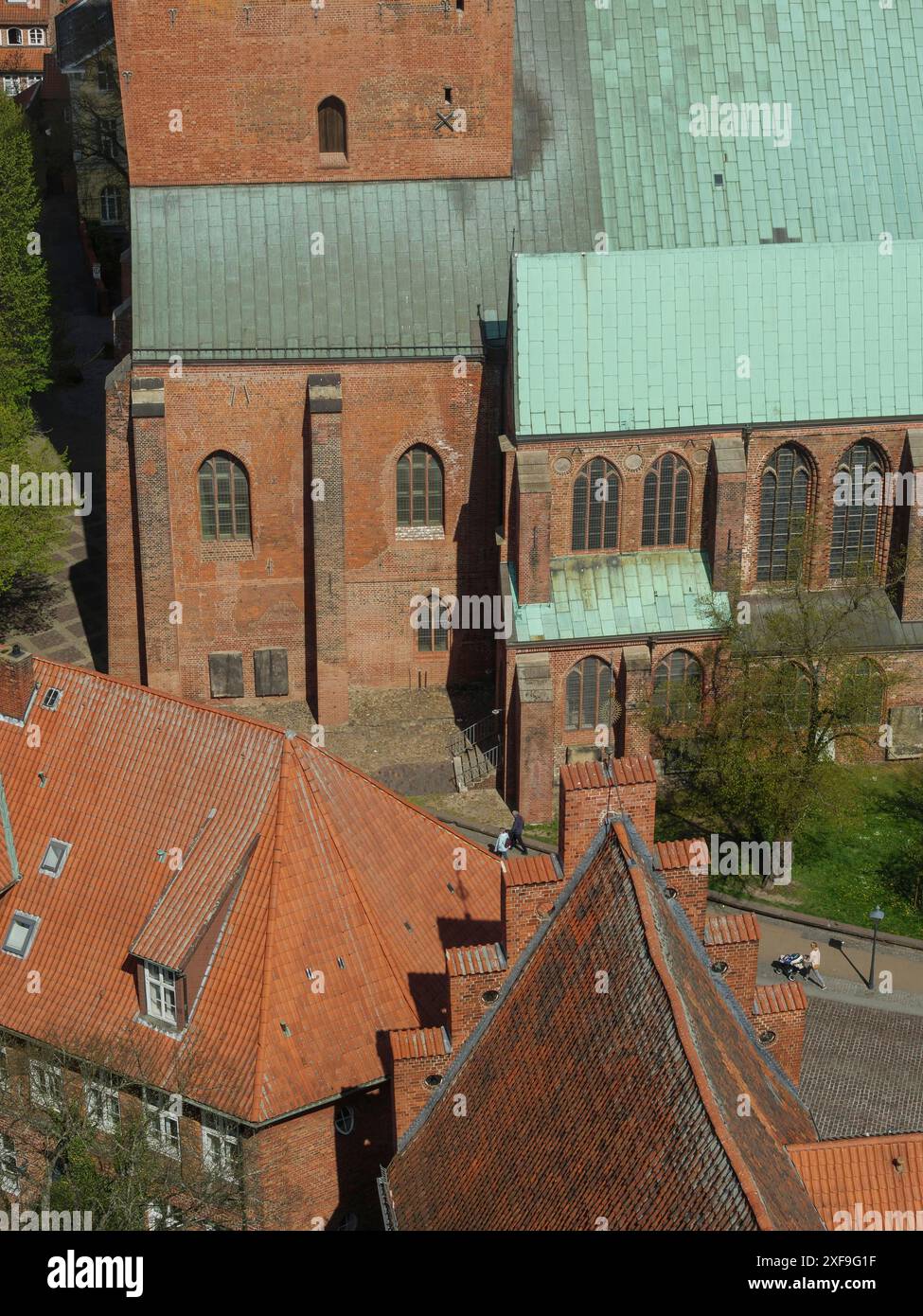 Detailed view of a large brick building with green roof, architectural ...