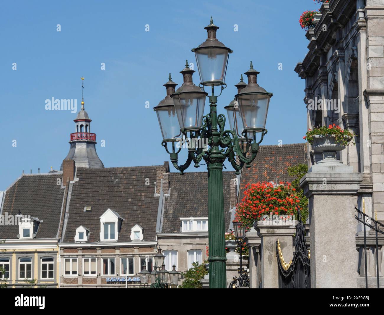 Streetlights and buildings in a historic city with ornate architecture ...