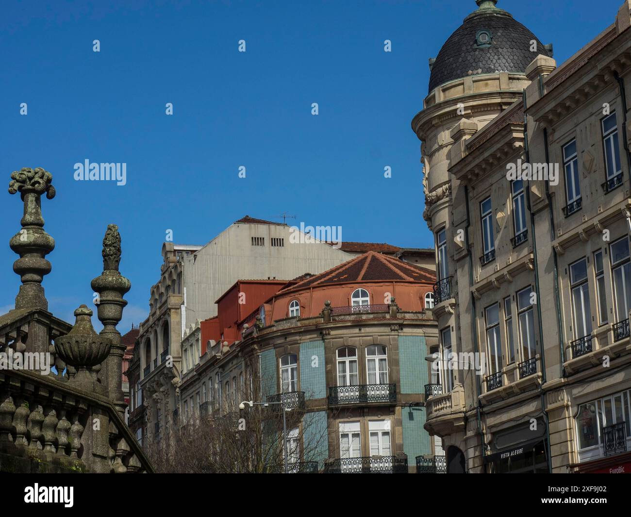 View of historic buildings with ornate tower and balconies under a ...