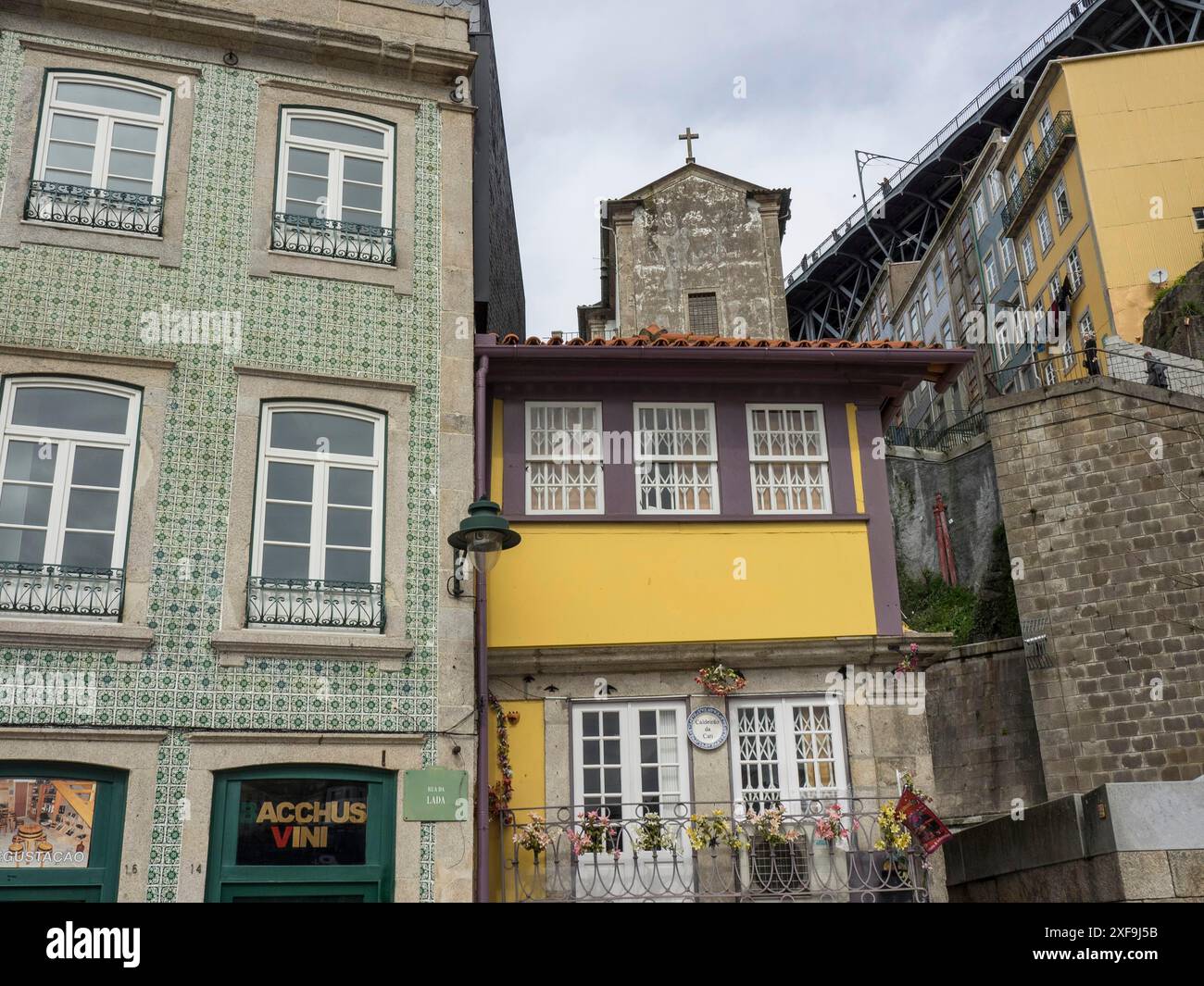 Two-storey buildings with colourful facades and a church in the ...