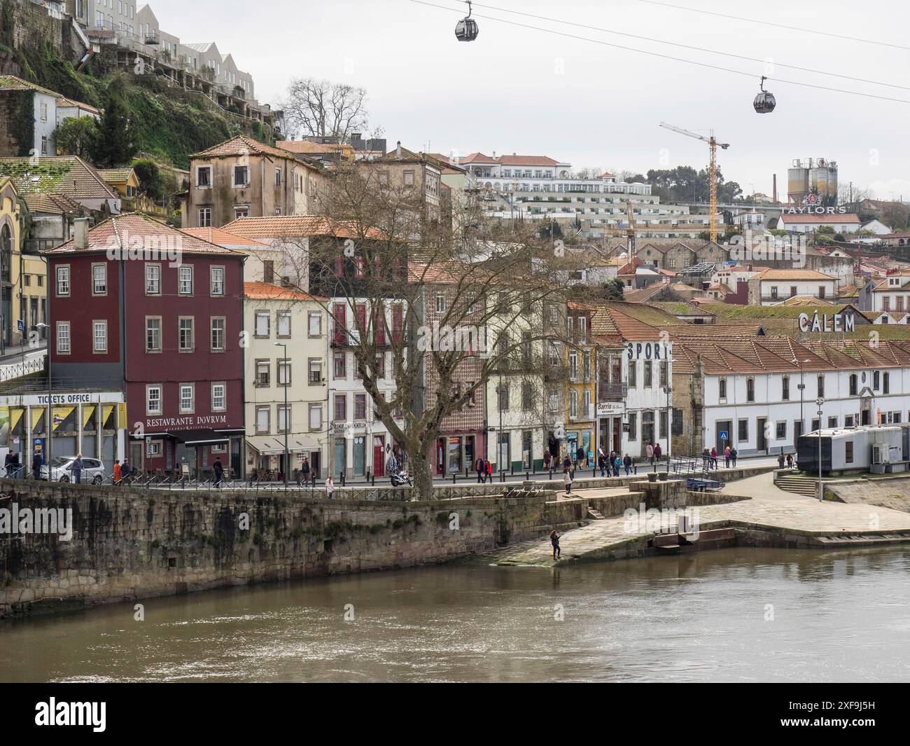 City view along a river with historic buildings and waterfront ...