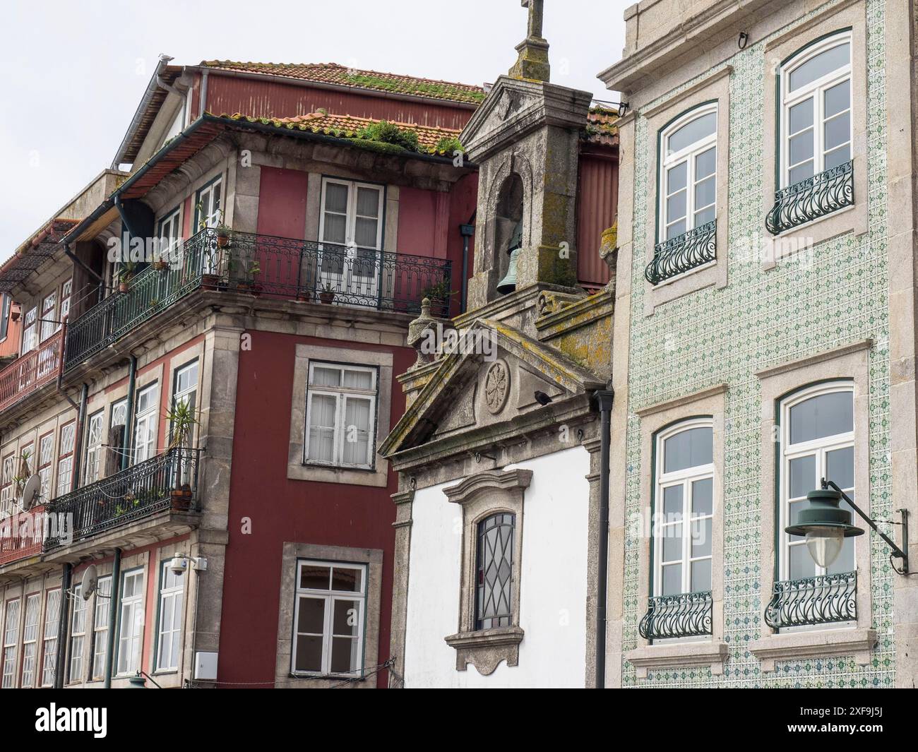 Series of historic buildings with different facades and balconies ...