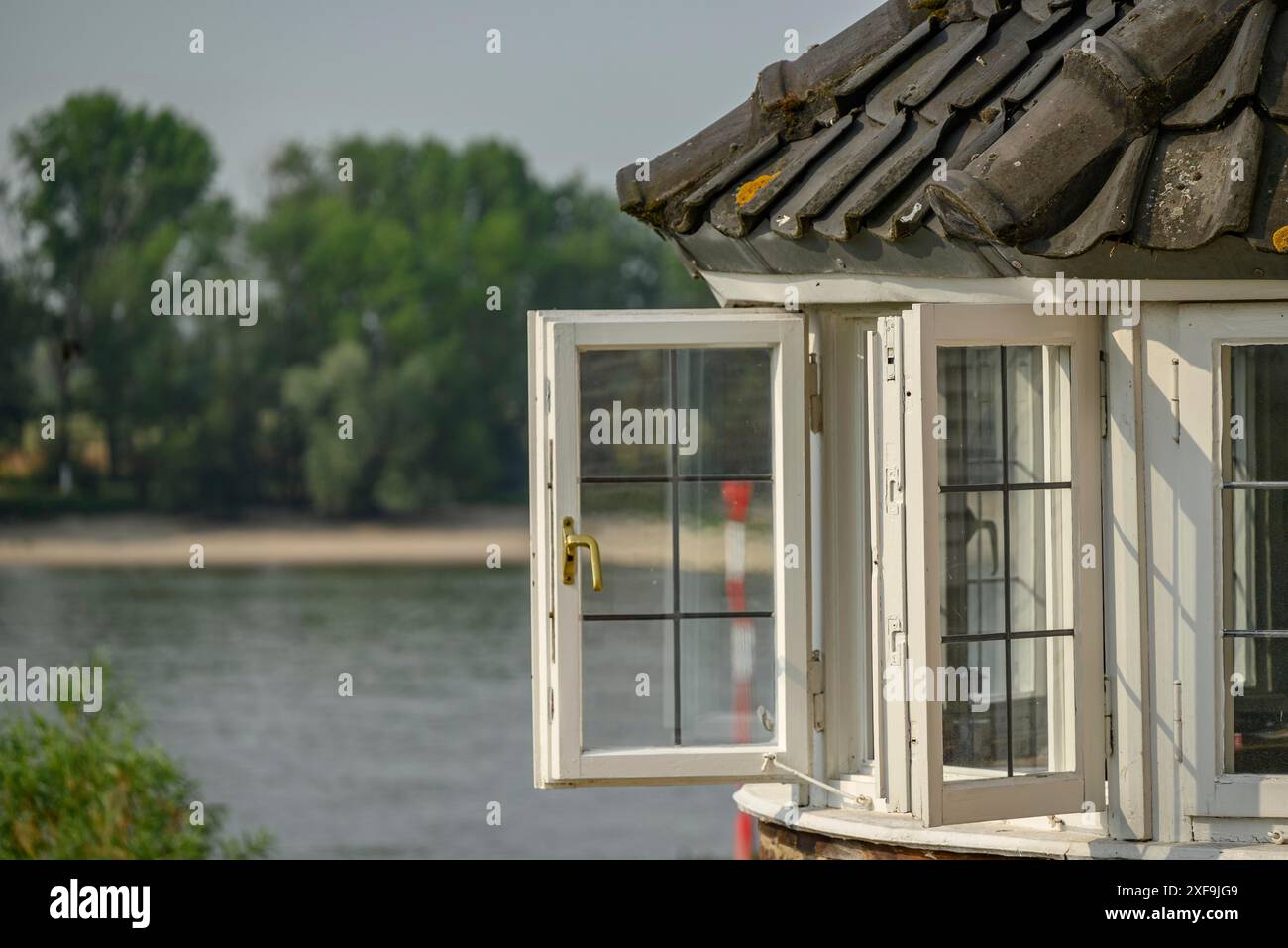 An open window of a house with a view of a river and trees, Rees ...
