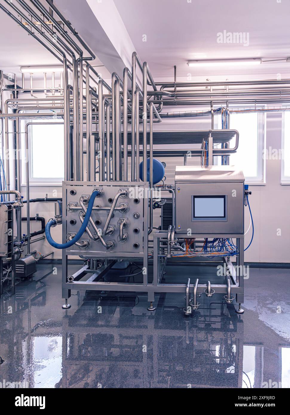 Modern milk pasteurization plant processing line equipment Stock Photo ...