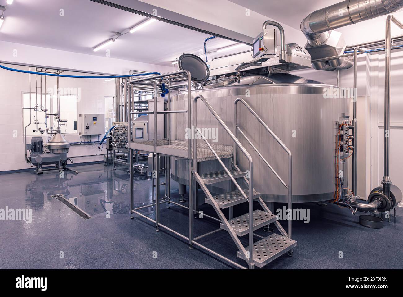 Interior of a food processing plant showing a large stainless steel ...