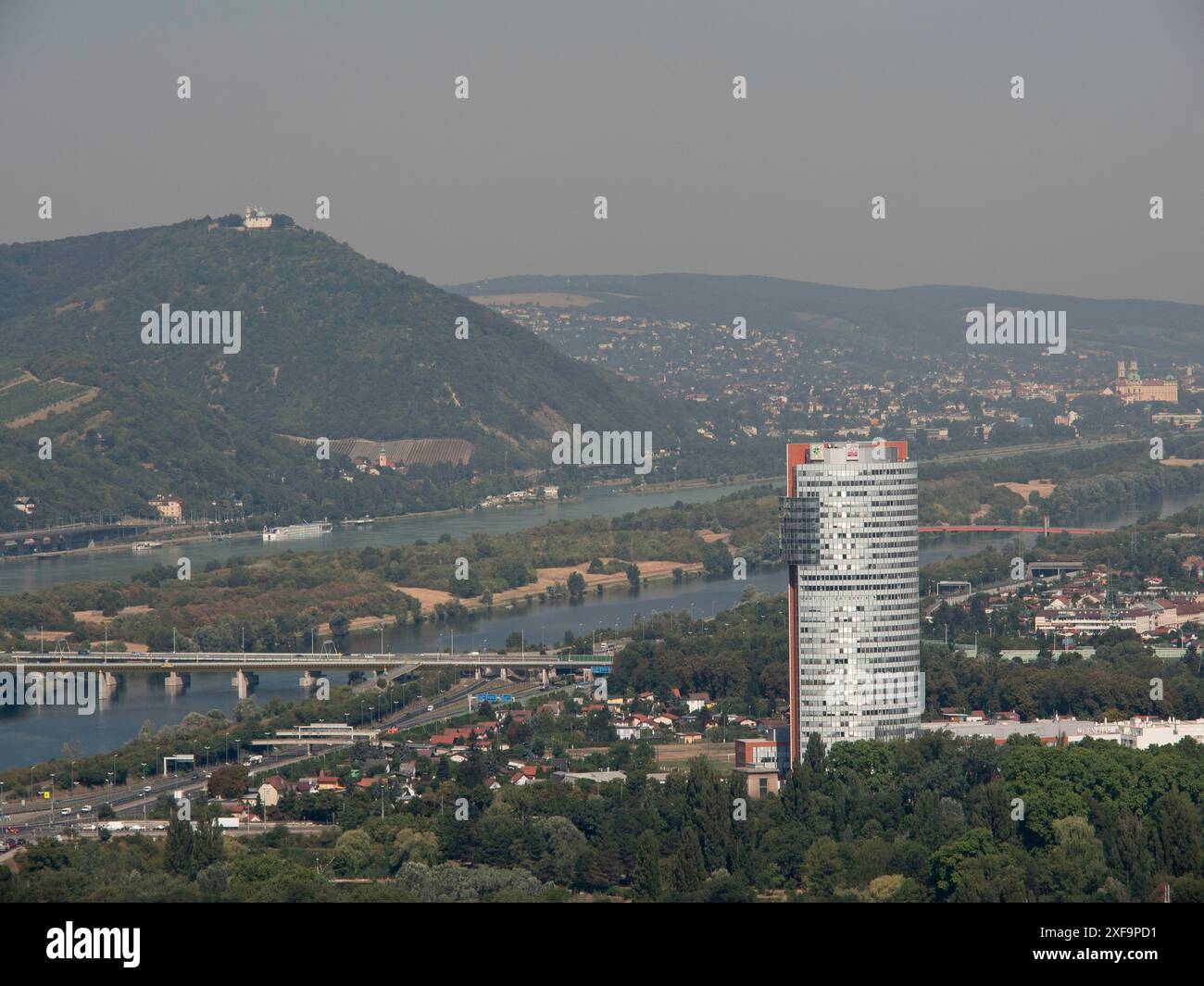 Urban panorama with river, mountains and modern buildings, Vienna ...