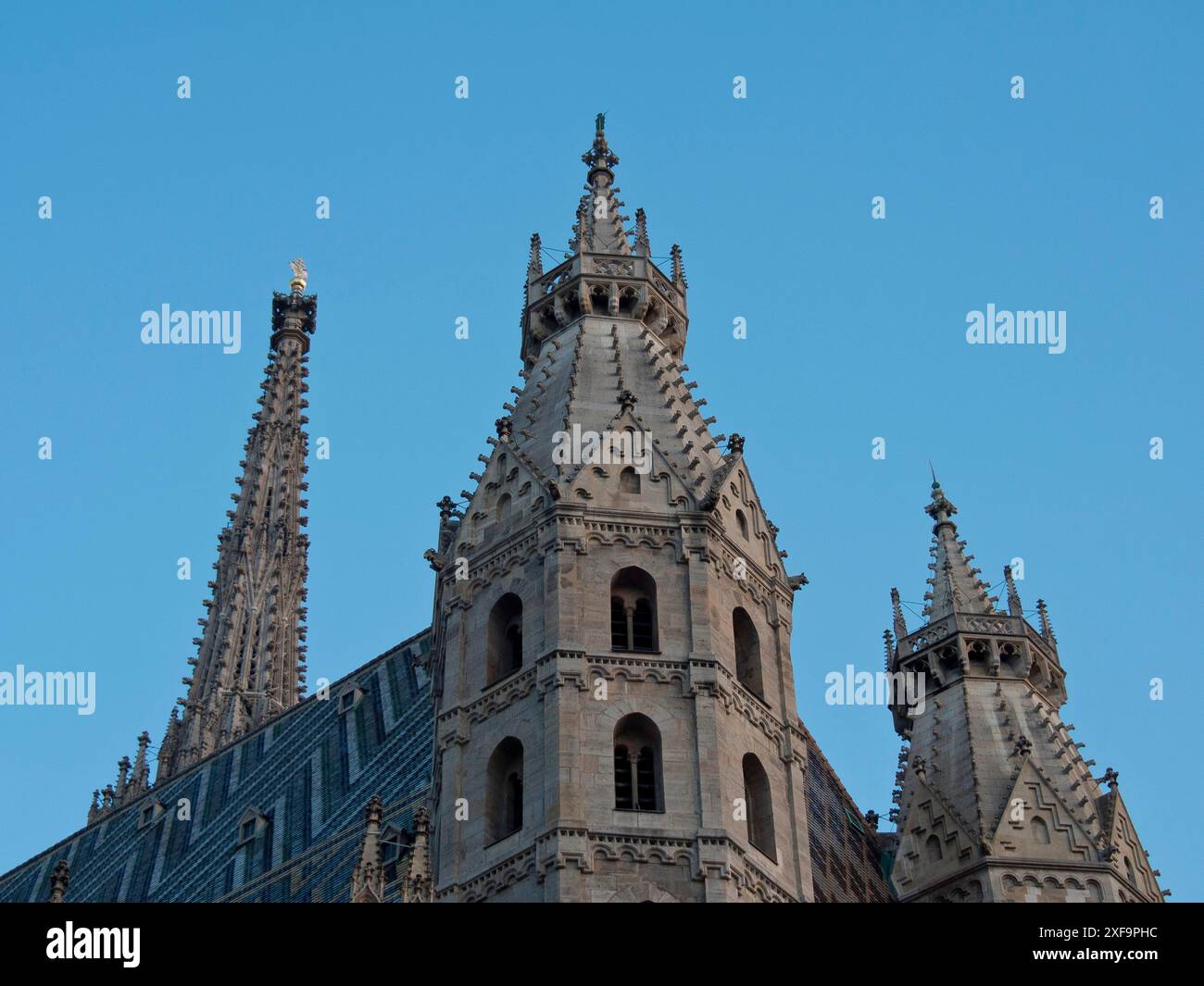 Gothic church with pointed towers and detailed stone structure under a ...