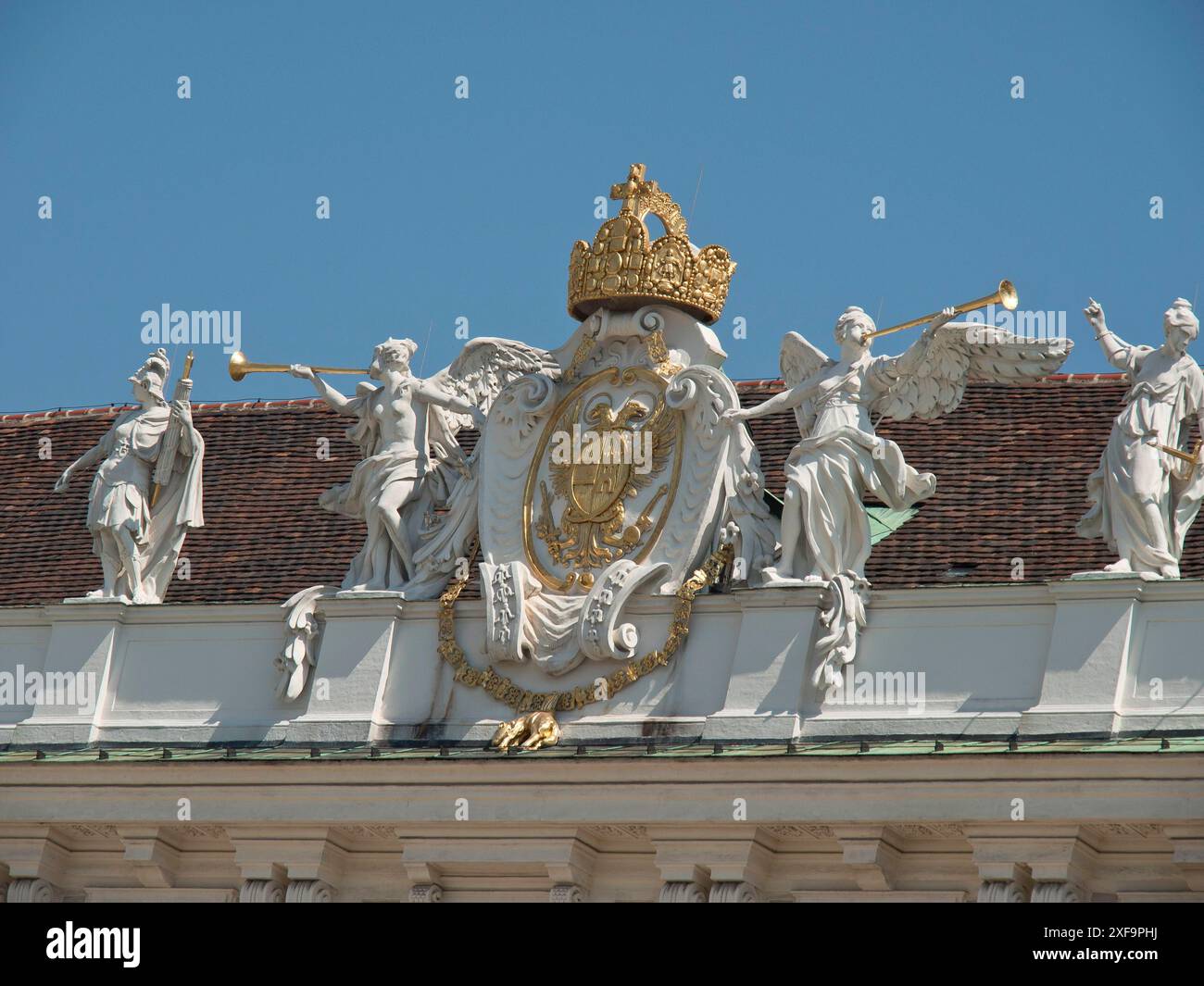 Decorative roof of a historic building, decorated with sculptures and a ...
