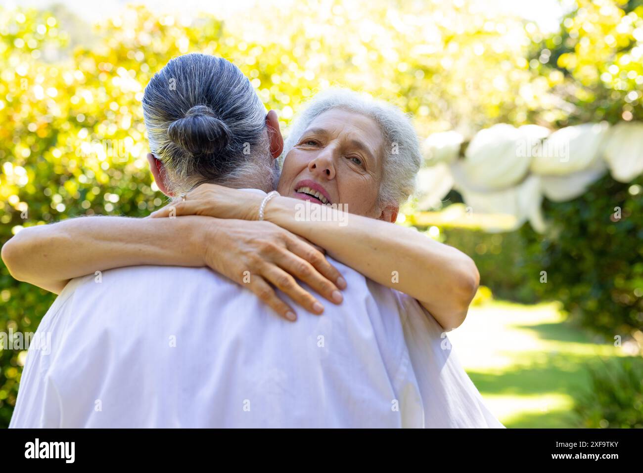 Senior bride hugging groom outdoors, at their wedding Stock Photo - Alamy