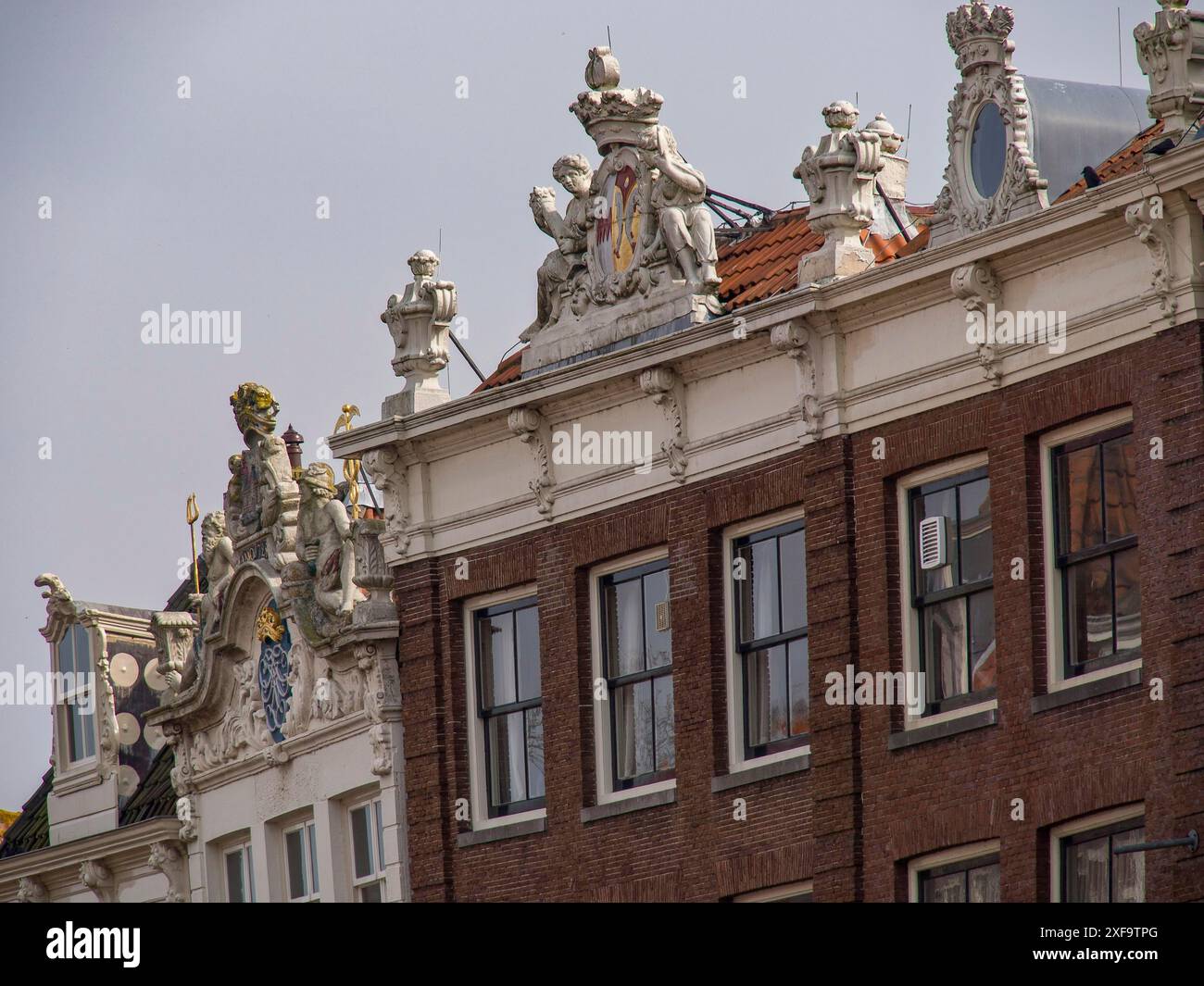 Decorated gable fronts of historic buildings with windows and ...