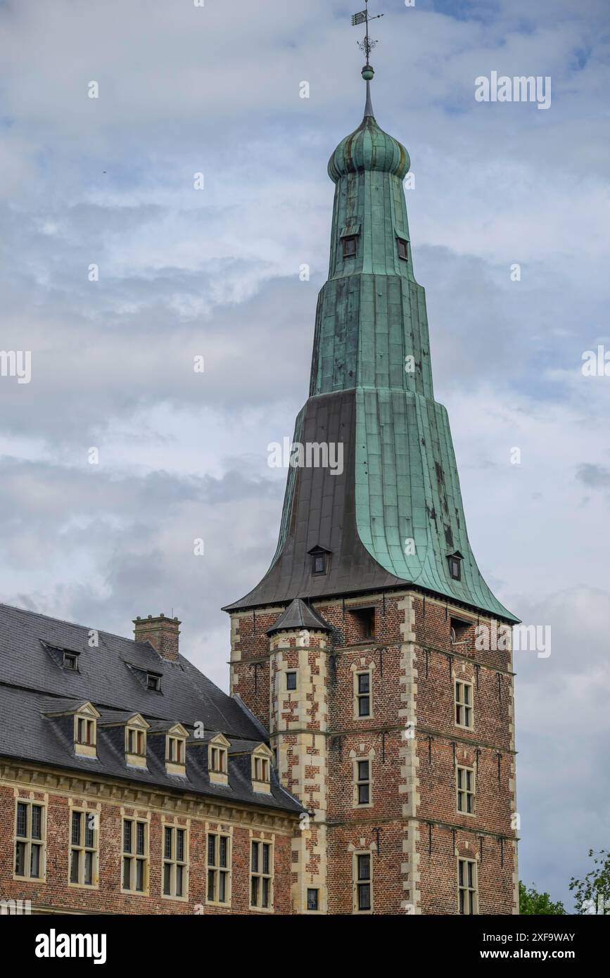 Historic onion dome with green copper roof on a building with brick ...