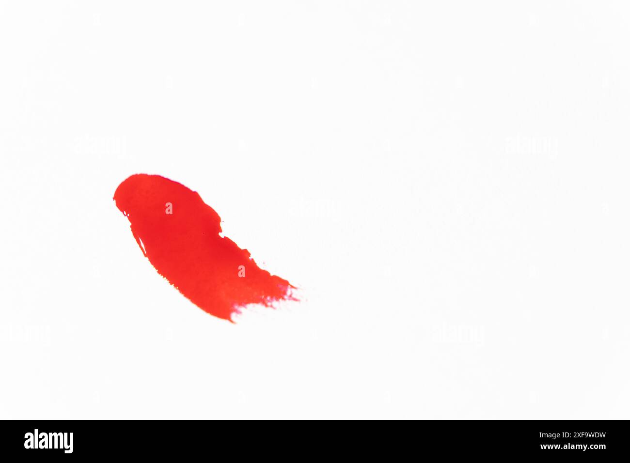 Red nail polish stroke on white background, polish texture, top view ...