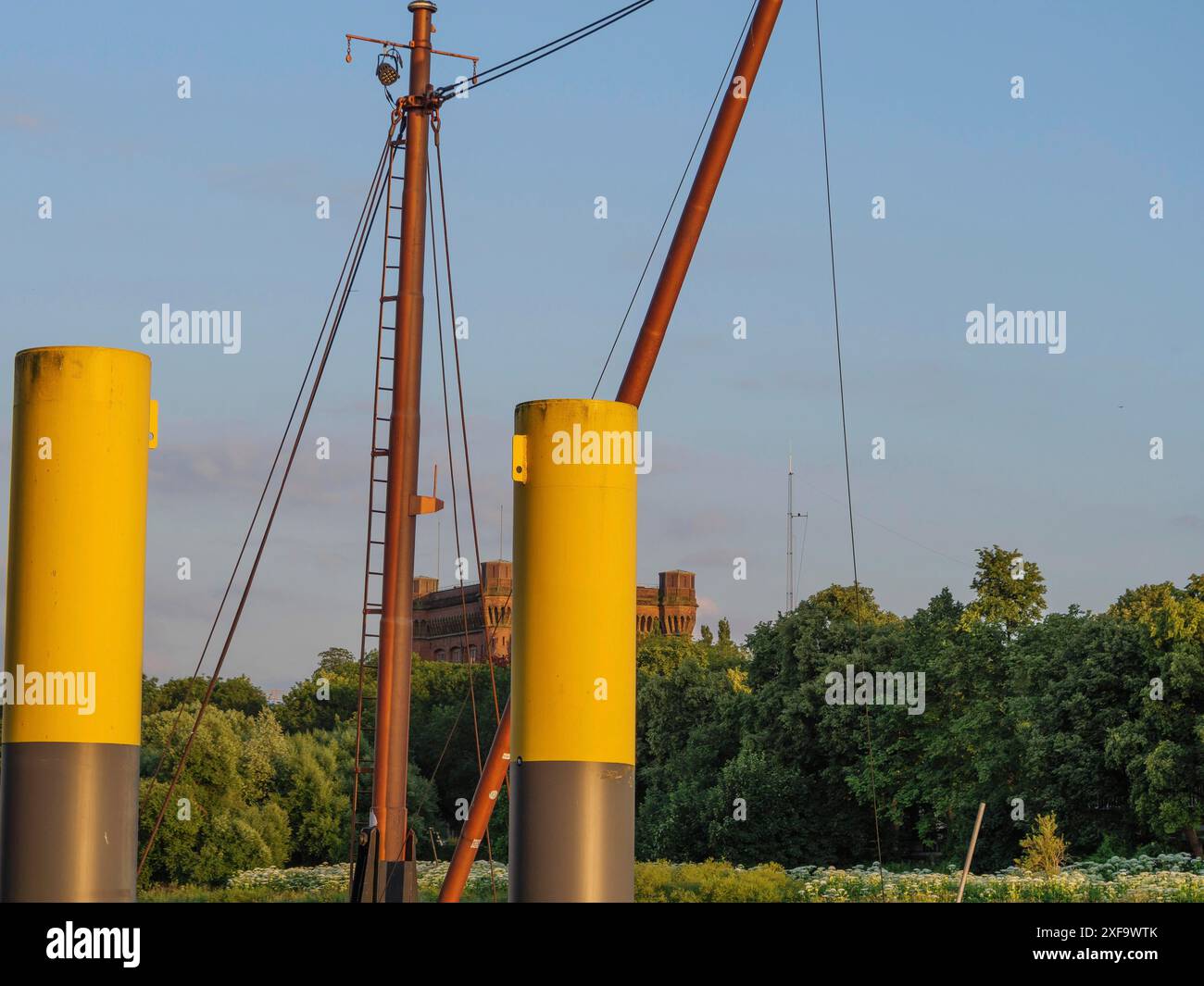 Harbour view with ship mast and railing in front of a green background ...