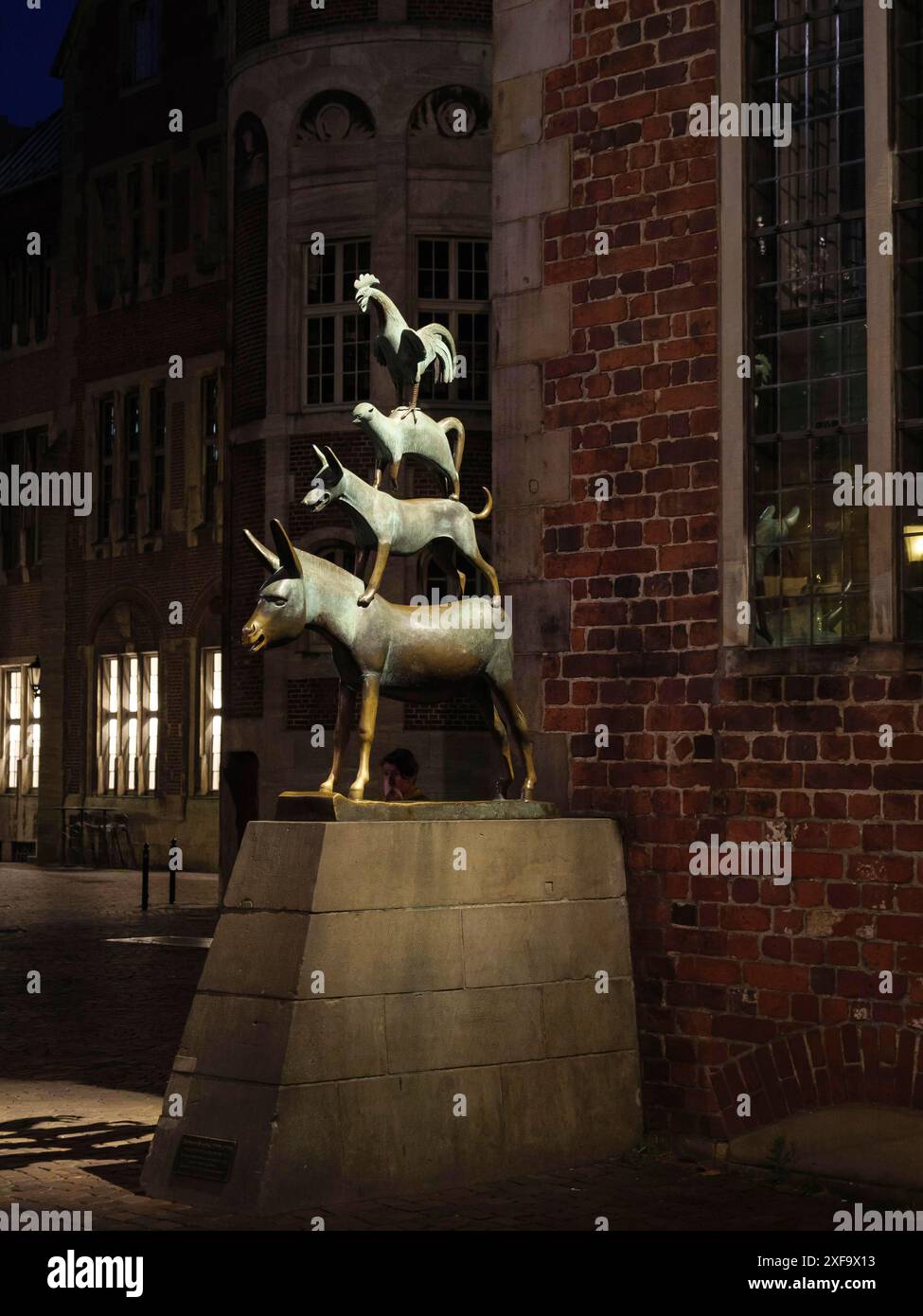Bronze sculpture of a donkey, dog, cat and rooster standing on top of ...