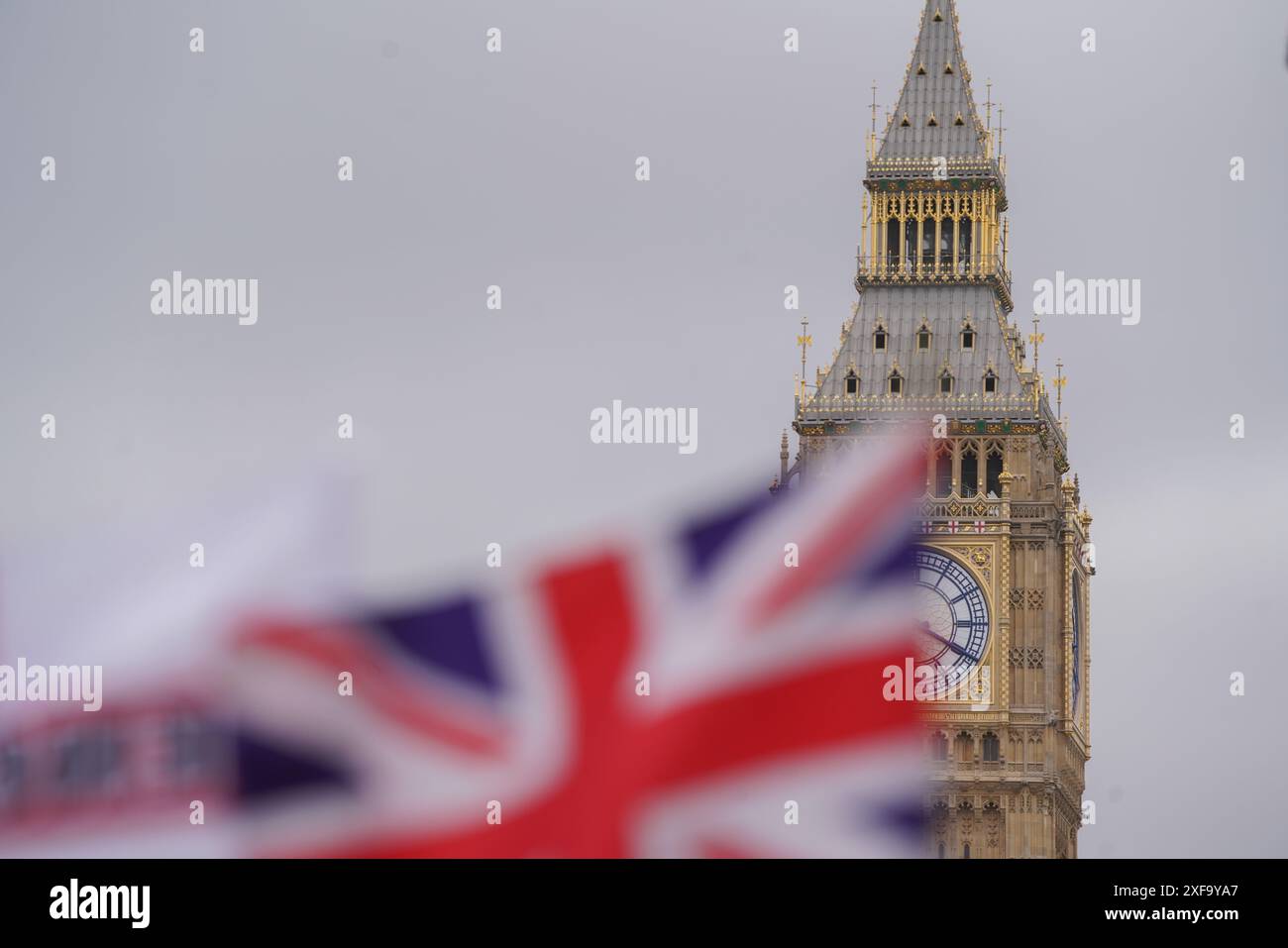 London, UK 2 July 2024. Union Jack flags flutter in the winder opposite ...