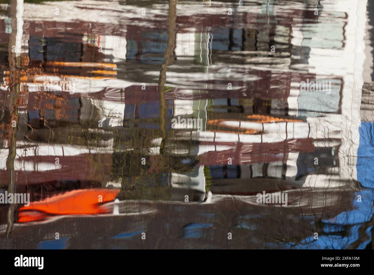 Abstract water reflection of a modern residential building in spring ...