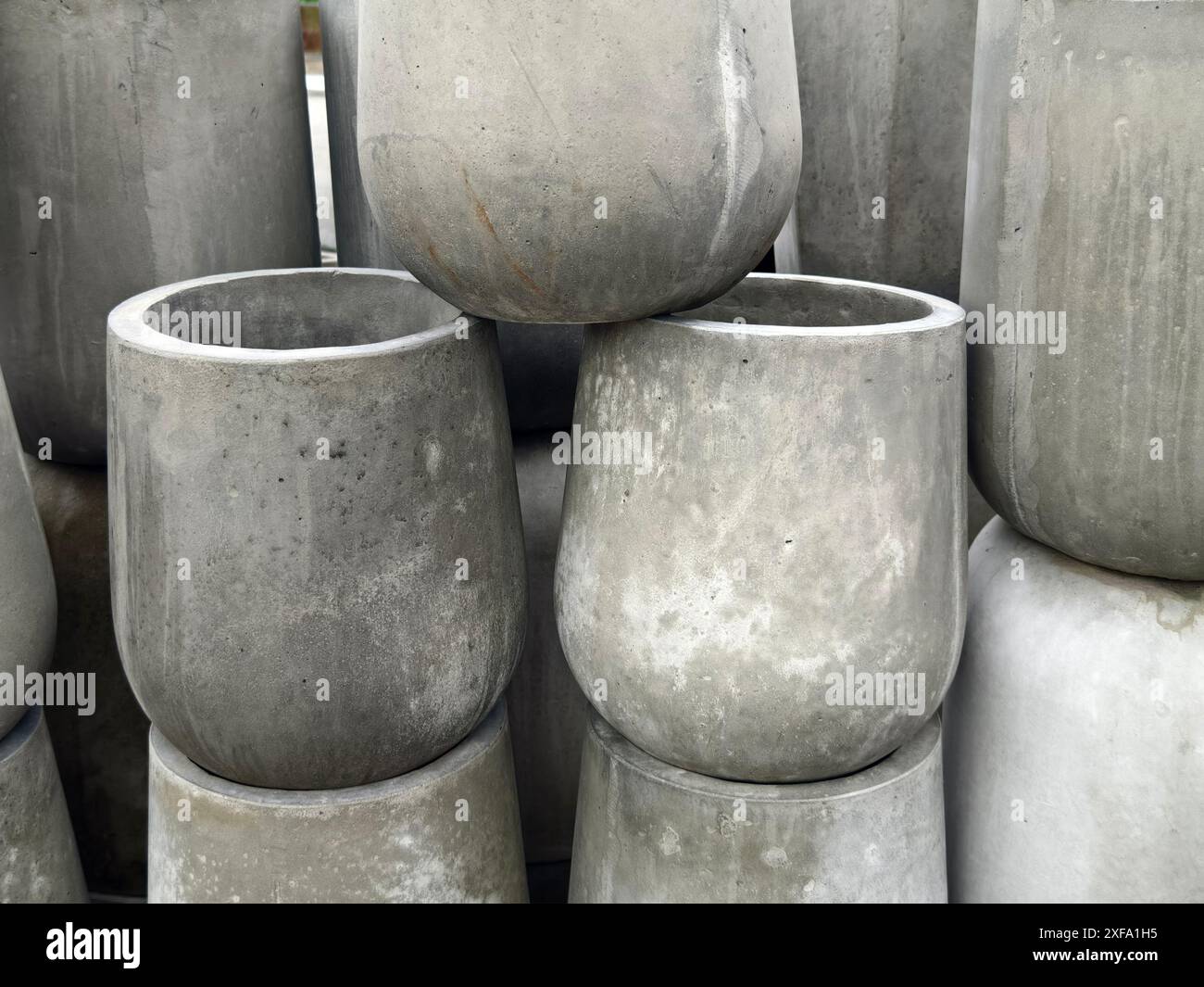 Several concrete plant pots are stacked on top of each other Stock ...