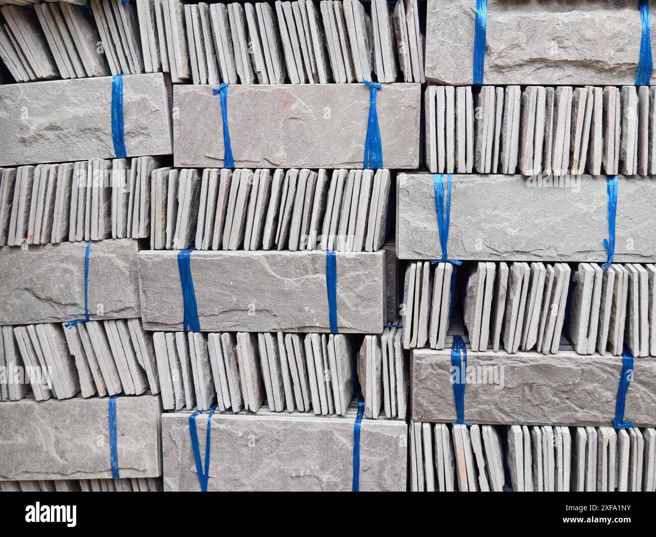 Brick stack tied with ropes for construction and building purposes ...