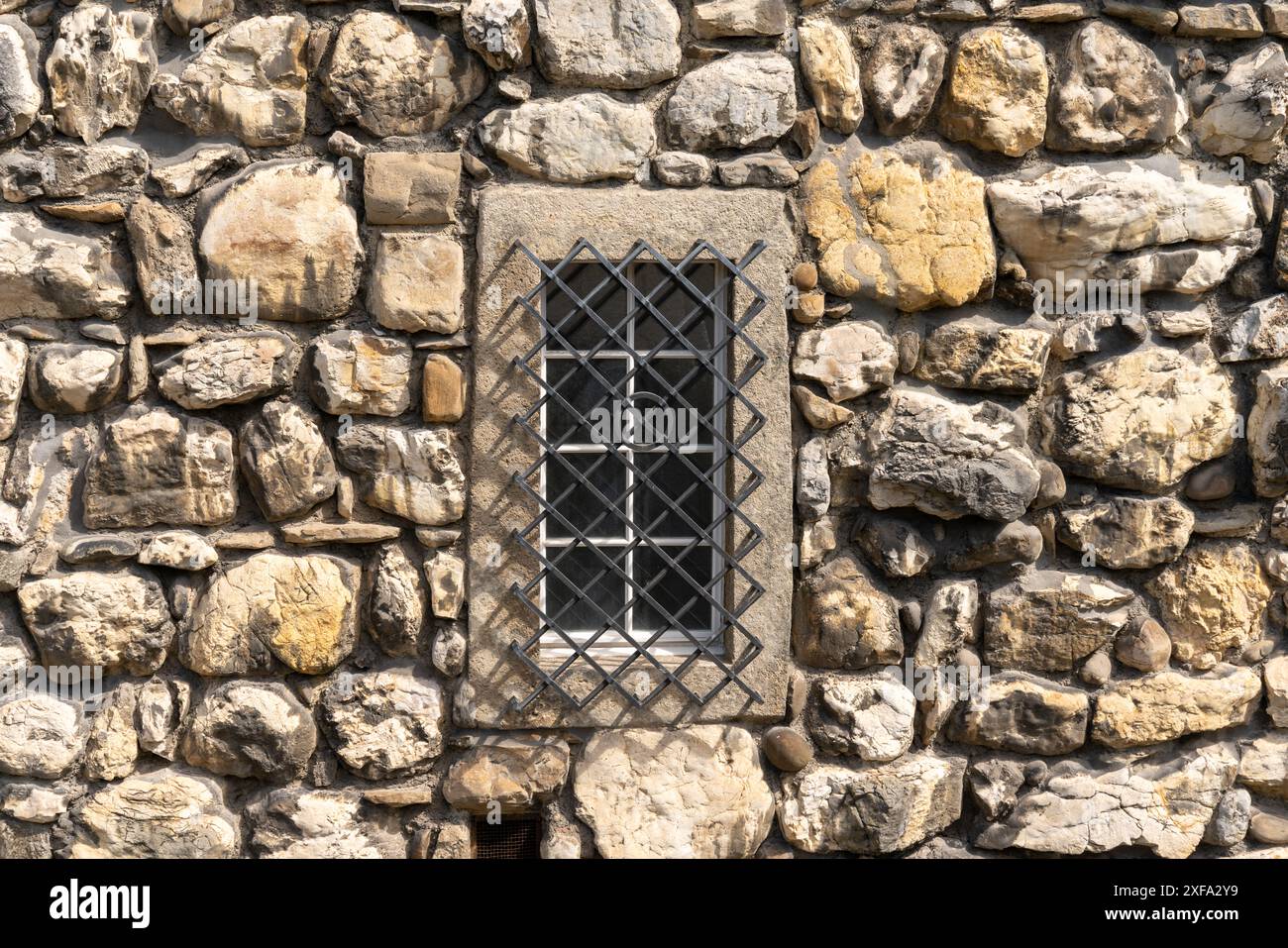 Texture of old stone wall with big boulders of limestone in different ...