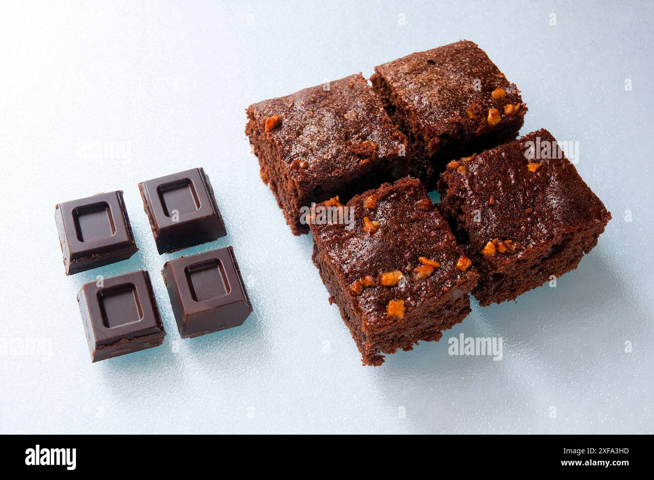 Four brownies and four chocolate squares Stock Photo - Alamy