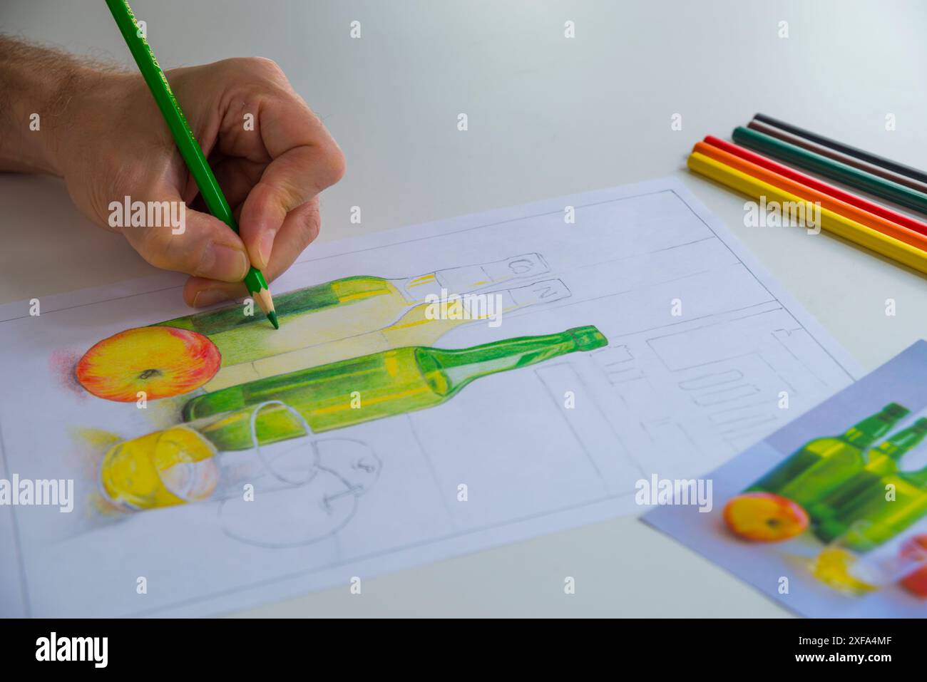 Man’s hand colouring an illustration with colour pencils Stock Photo ...