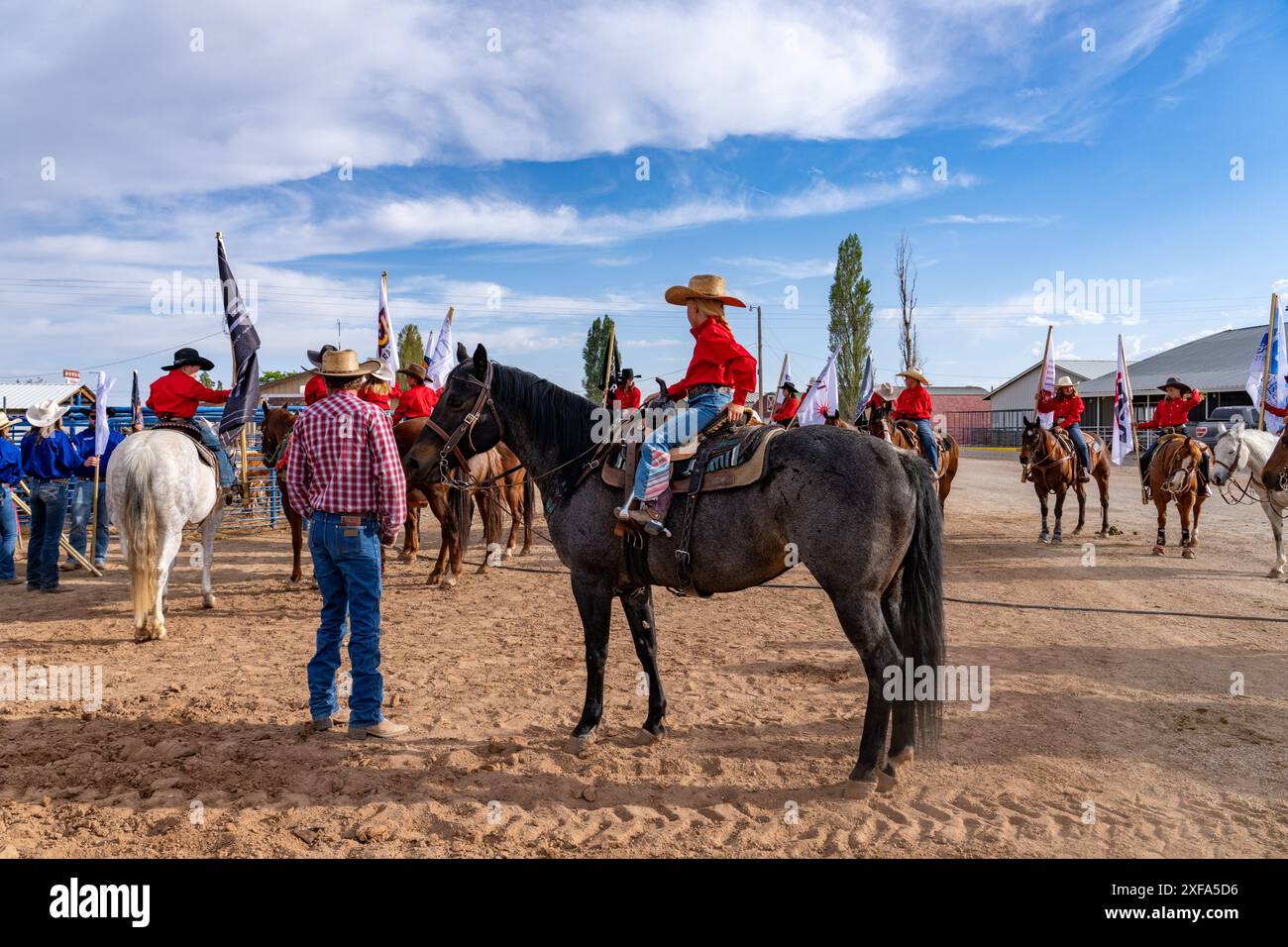 Young cowboys & cowgirls form up before the Grand Entry at a rodeo in a ...
