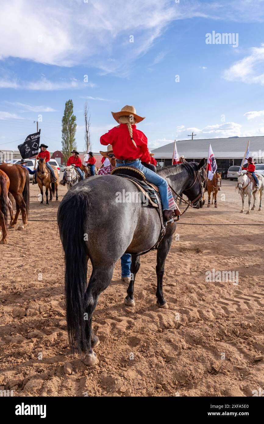 Young cowboys & cowgirls form up before the Grand Entry at a rodeo in a ...