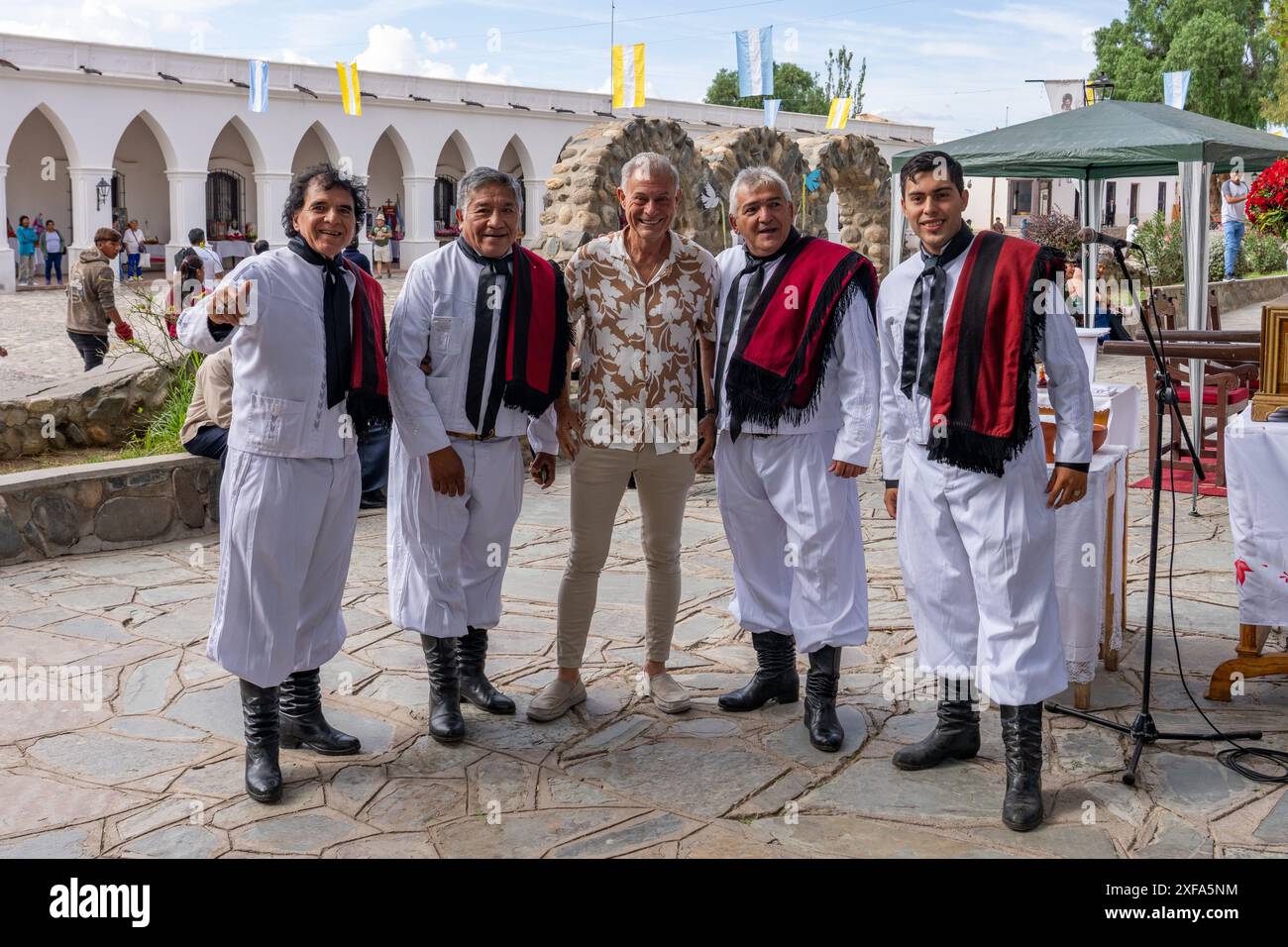 Gaucho singers in traditional outfits perform in the plaza at the ...