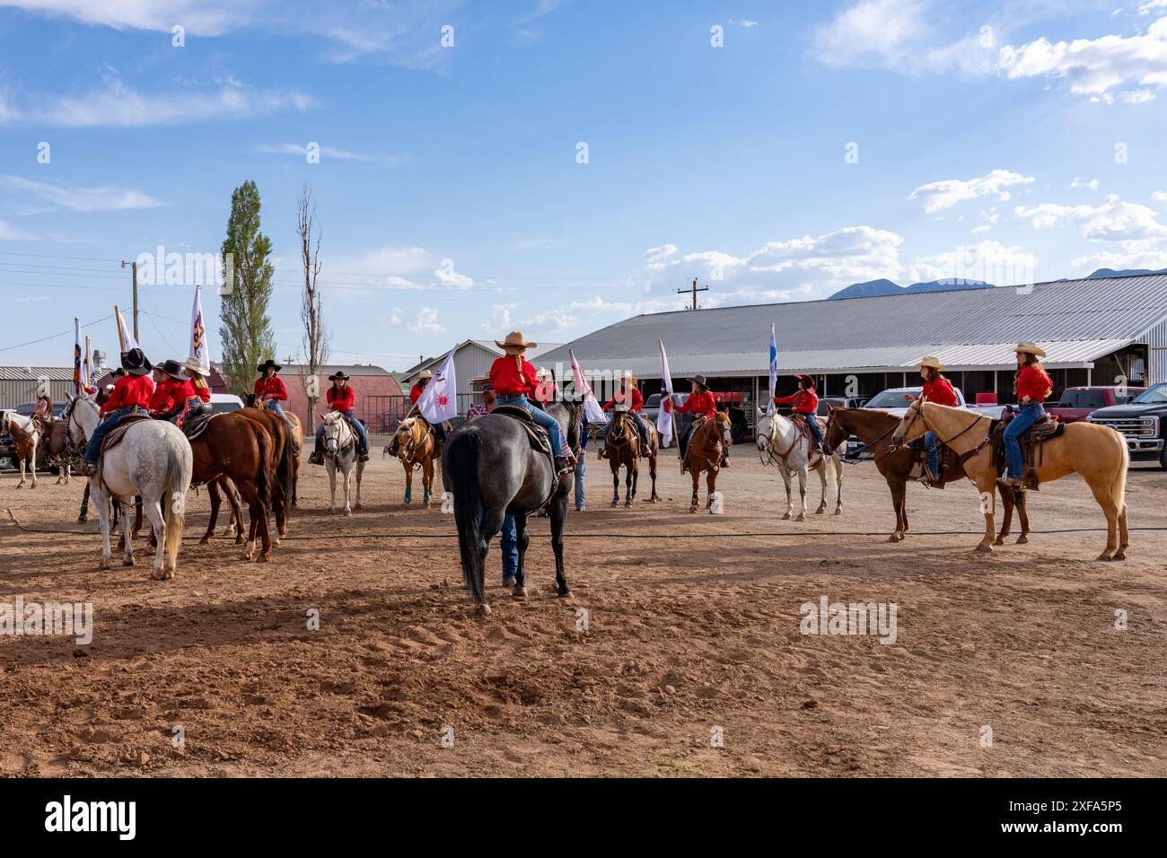Young cowboys & cowgirls form up before the Grand Entry at a rodeo in a ...