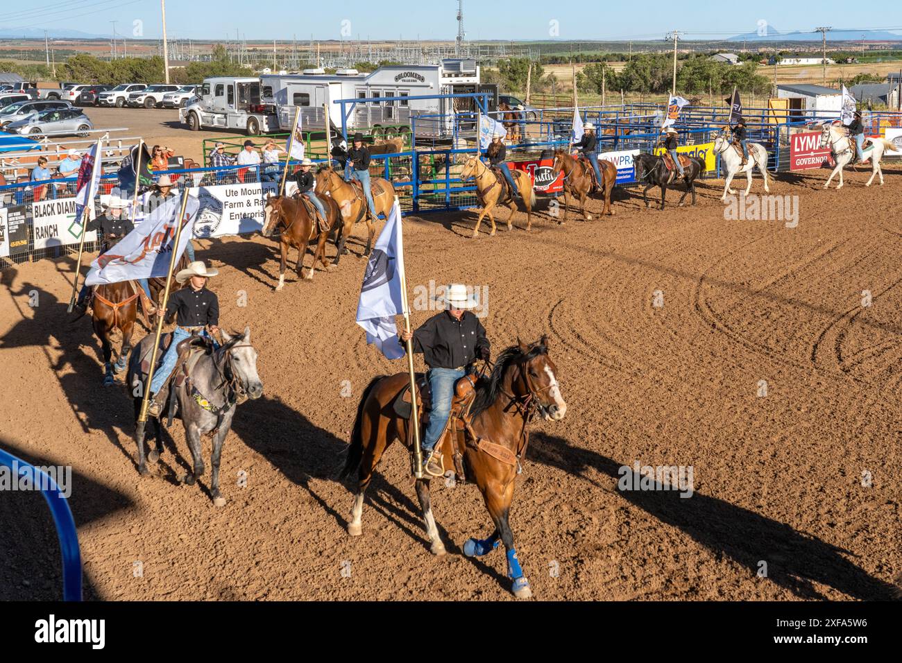 Young cowgirls & cowboys carry the sponsors flags in the Grand Entry at ...
