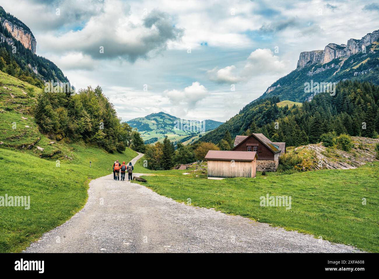 Rustic village with tourists walking in Alpstein mountain between ...
