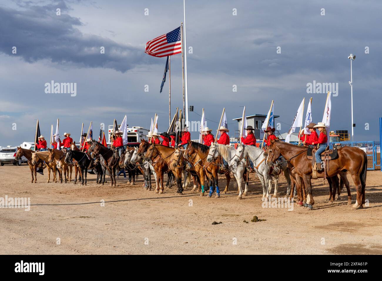 Young cowboys & cowgirls form up before the Grand Entry at a rodeo in a ...