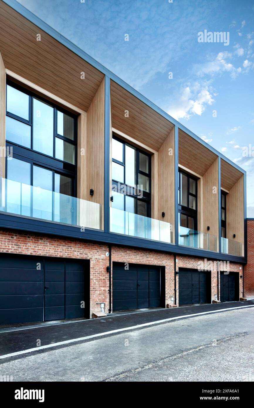 contemporary modern flats with high windows glass balconies and garages ...