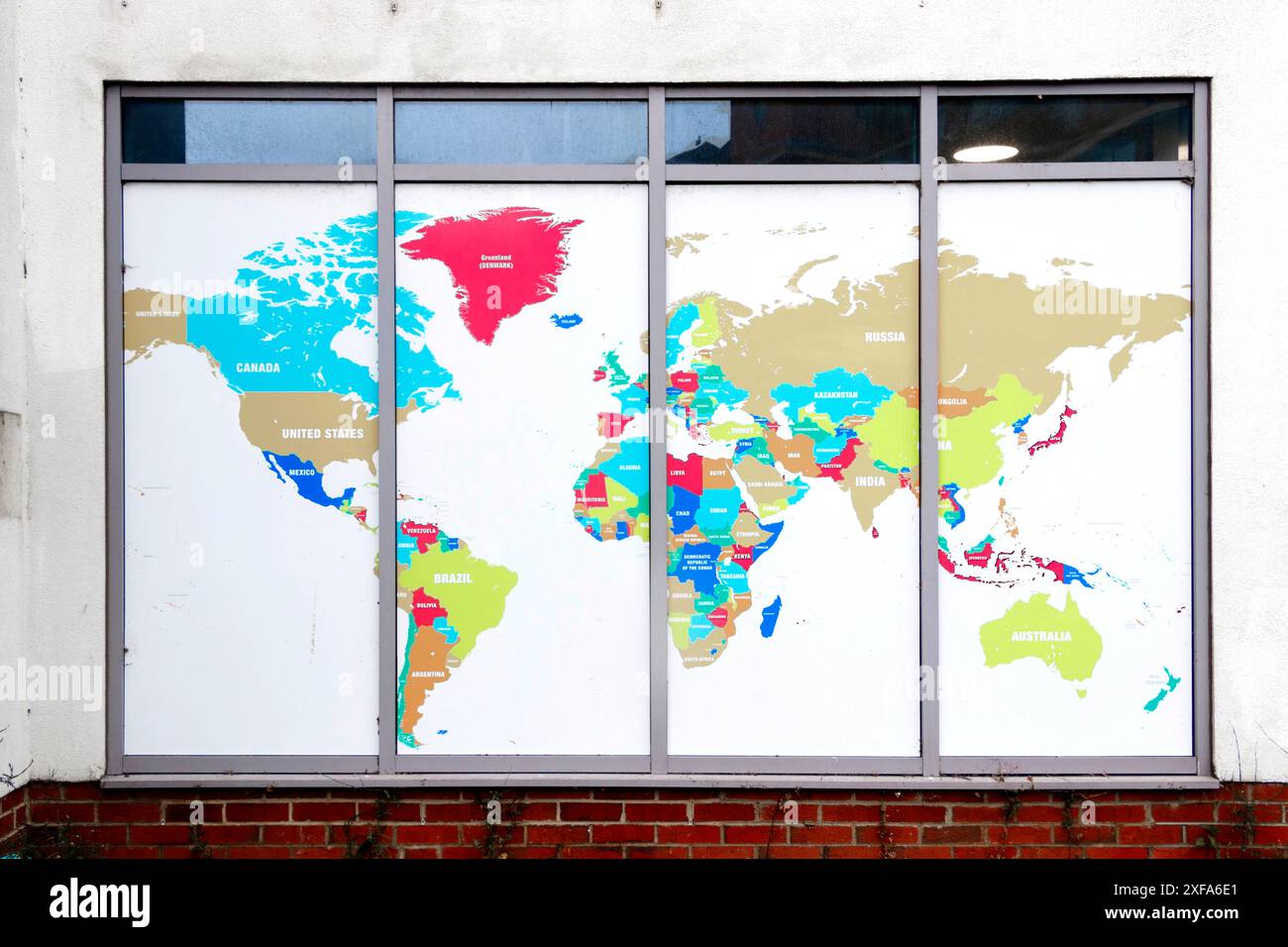 graphic of world map in shop window newcastle upon tyne Stock Photo - Alamy